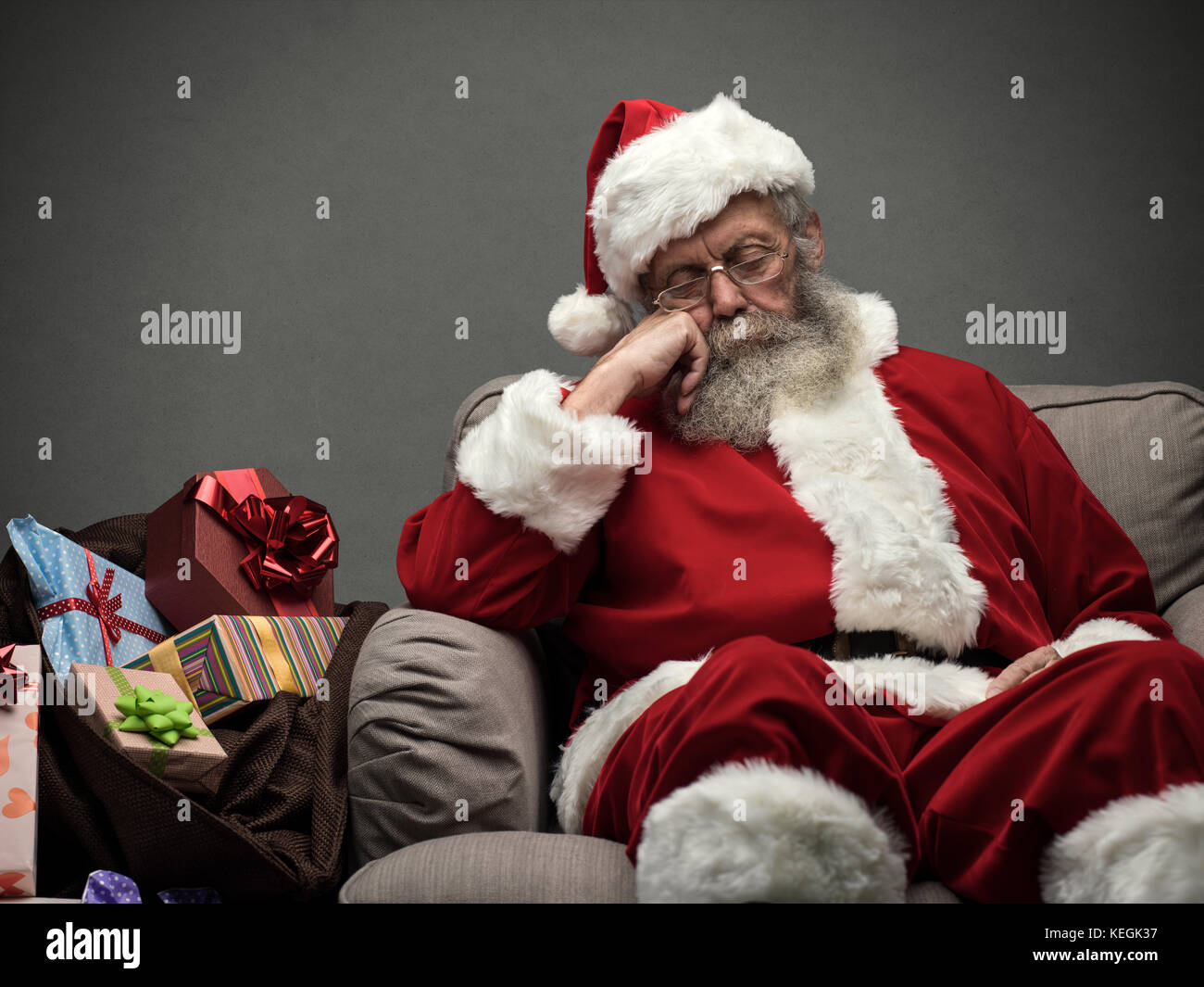 Sleepy Santa Claus taking a nap and relaxing on the armchair on ...