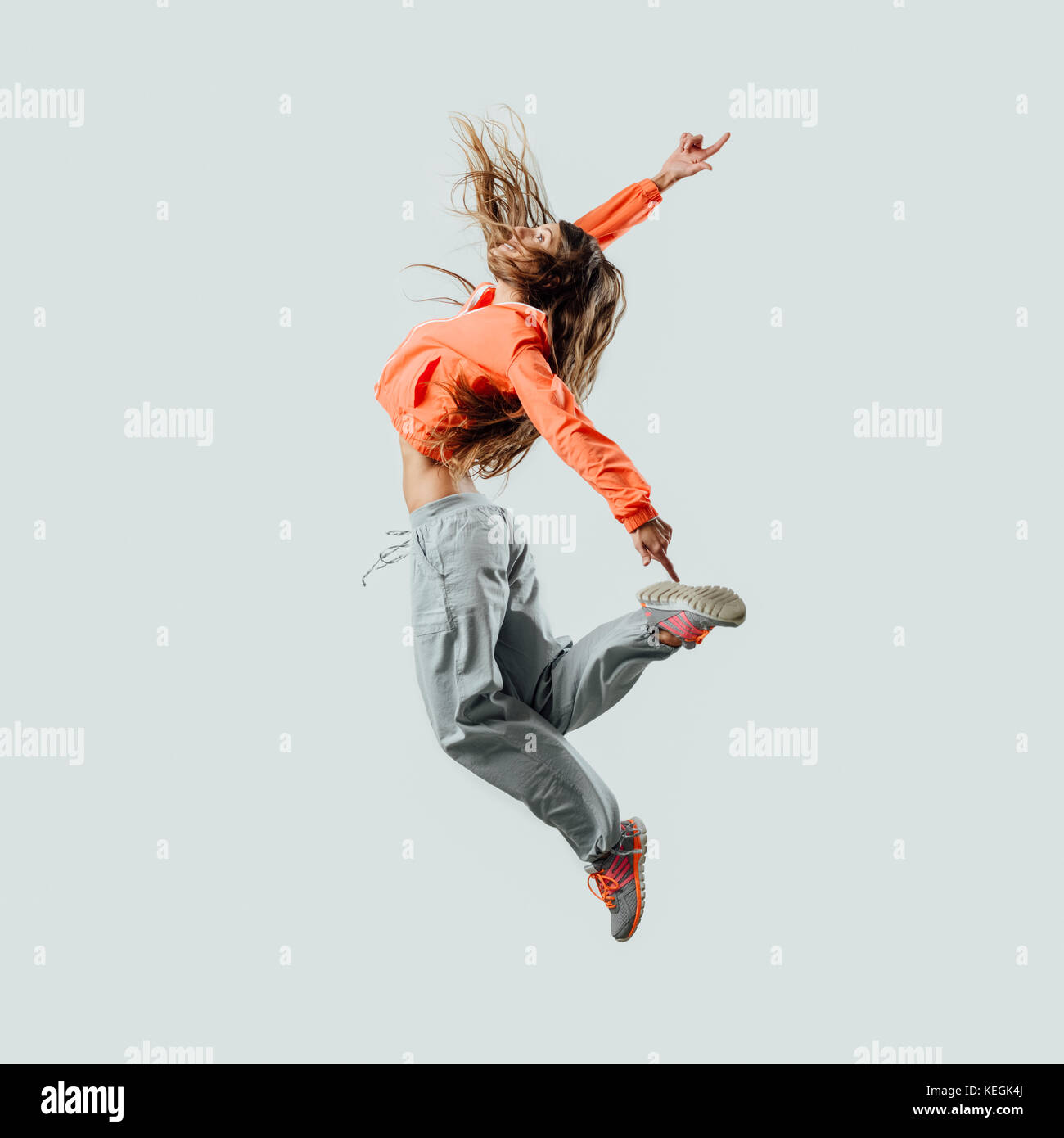 Athletic modern style dancer jumping and moving, energy and fitness ...