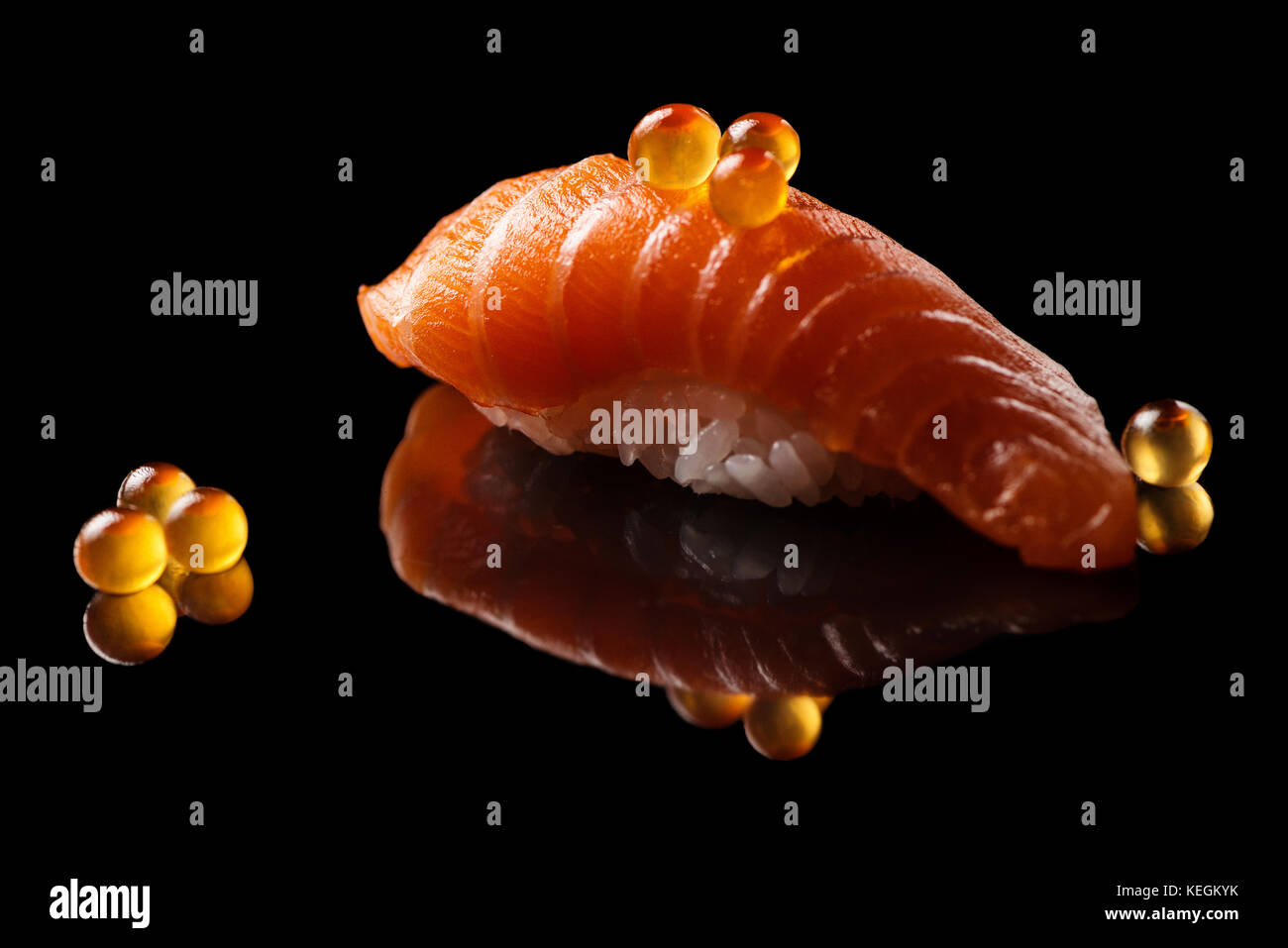Closeup composition of fresh salmon sashimi sushi with caviar isolated ...