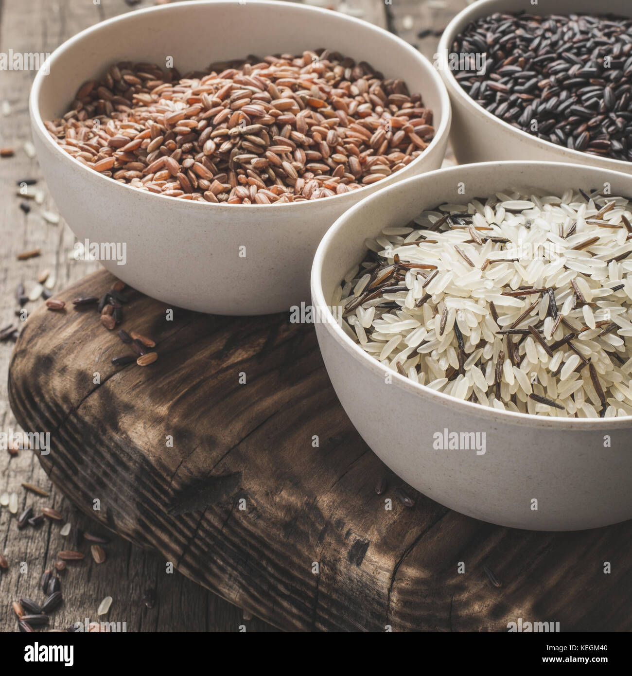collection of different varieties of rice on wooden rustic background ...
