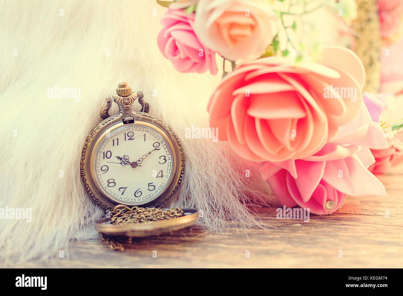 Vintage pocket watch with rose bouquet Stock Photo - Alamy