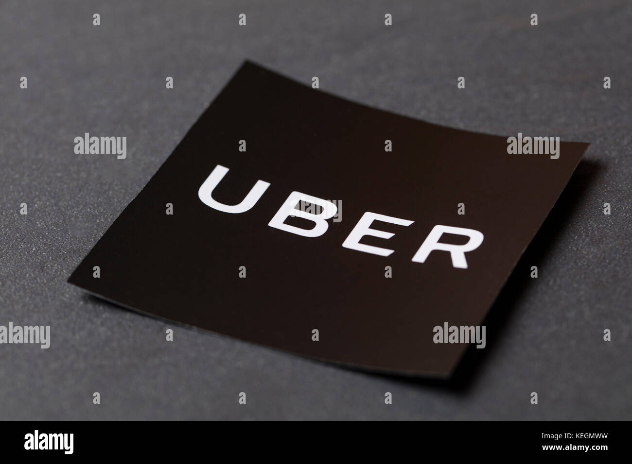 A photograph of the Uber logo. Uber is a popular taxi style transport ...