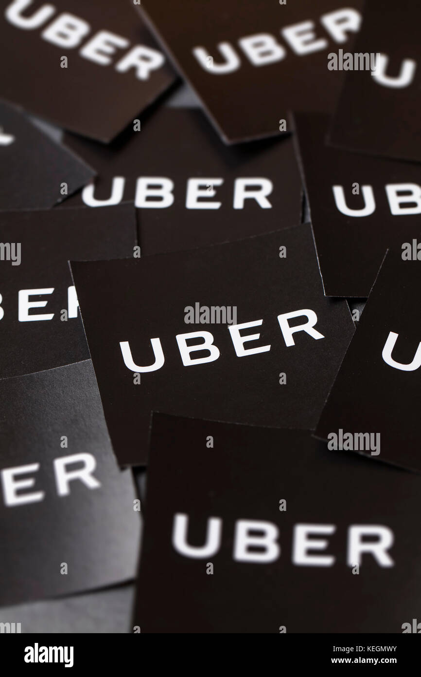 A photograph of the Uber logo. Uber is a popular taxi style transport ...