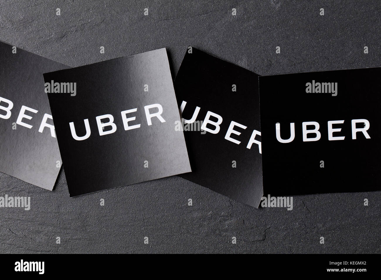 A photograph of the Uber logo. Uber is a popular taxi style transport ...