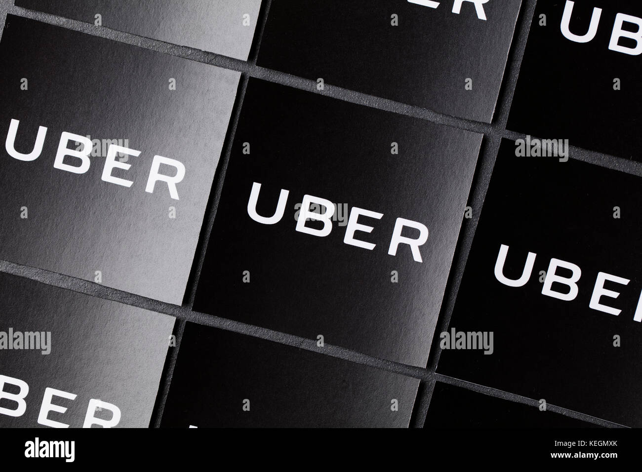 A photograph of the Uber logo. Uber is a popular taxi style transport ...