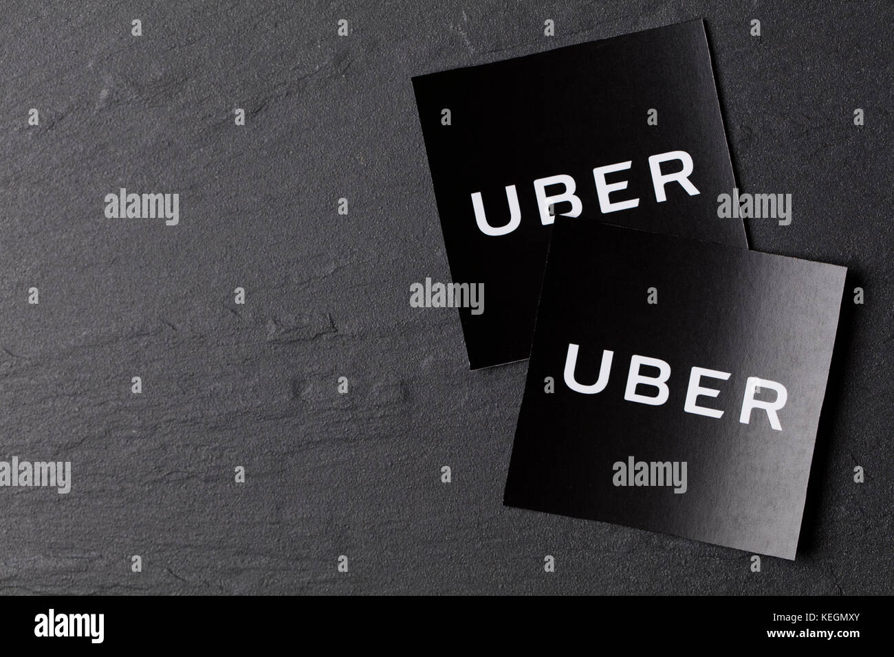 A photograph of the Uber logo. Uber is a popular taxi style transport ...