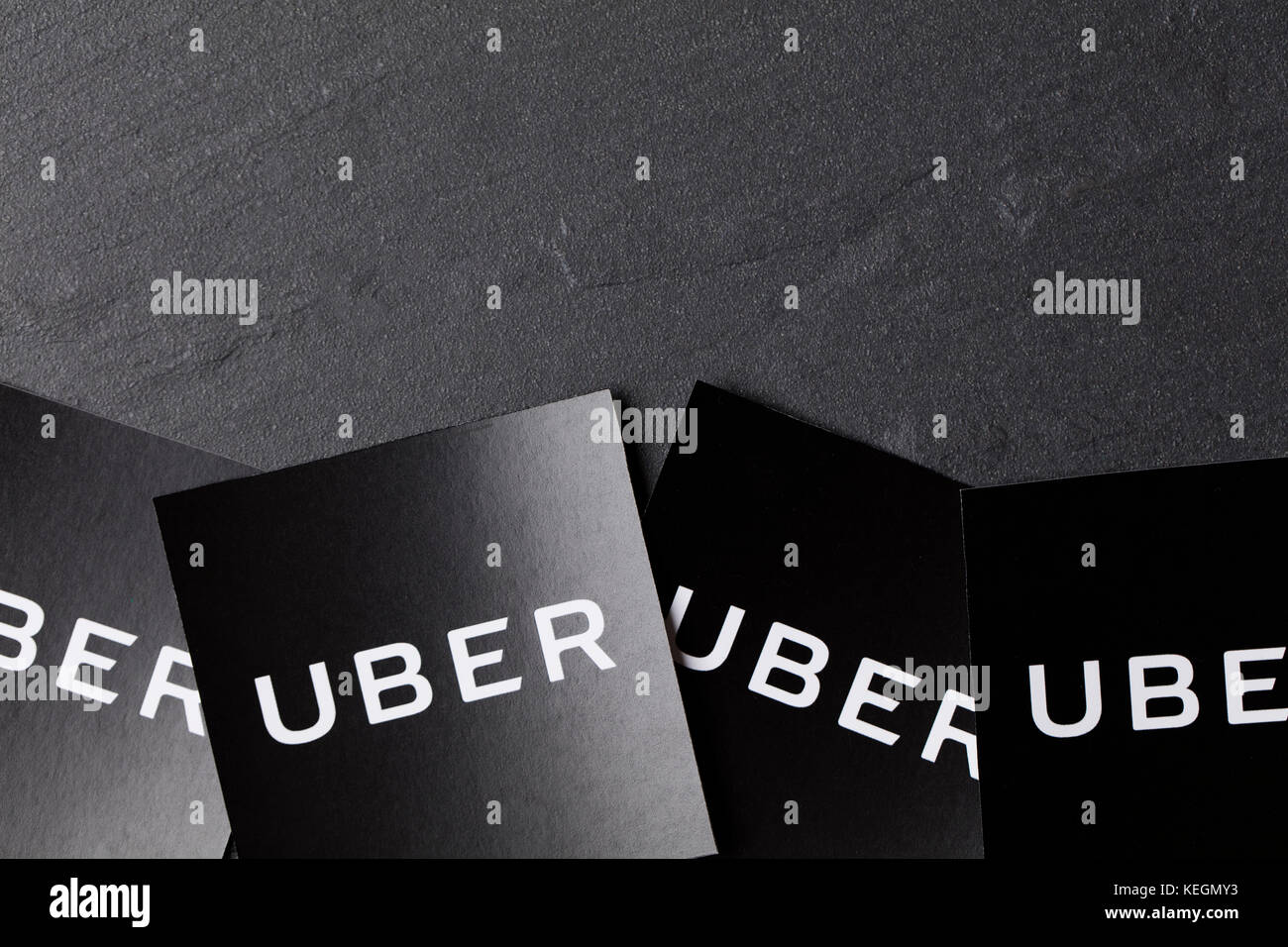 A photograph of the Uber logo. Uber is a popular taxi style transport ...