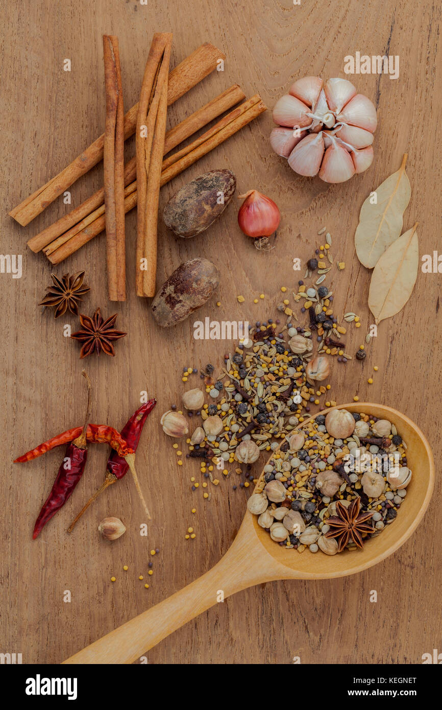 Assorted of spices in wooden spoon black pepper ,white pepper, black ...