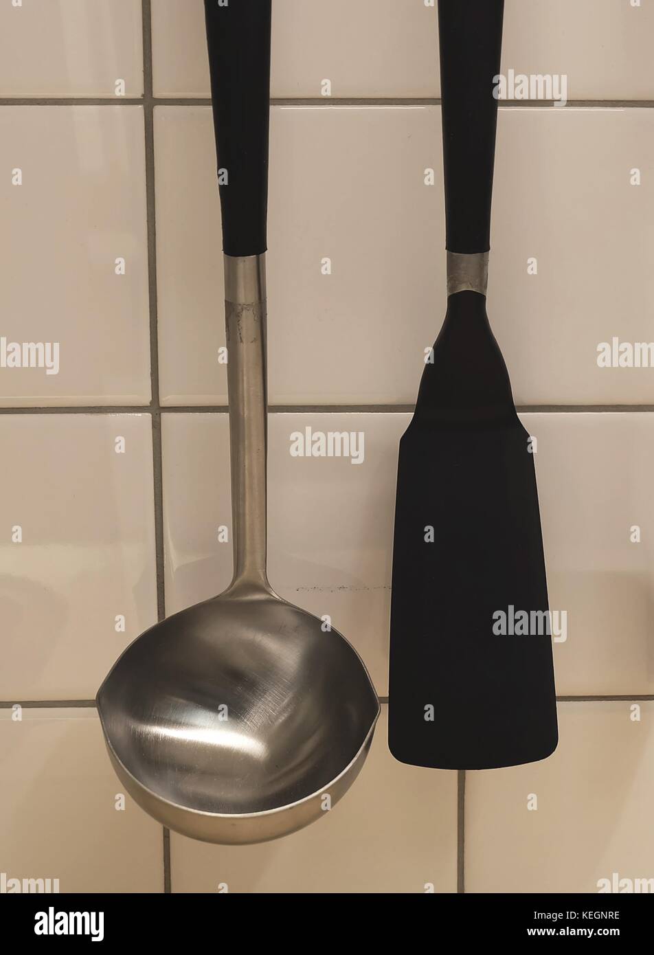Kitchen Equipment, Flippers and Ladles Hanging on The Wall, Kitchen ...