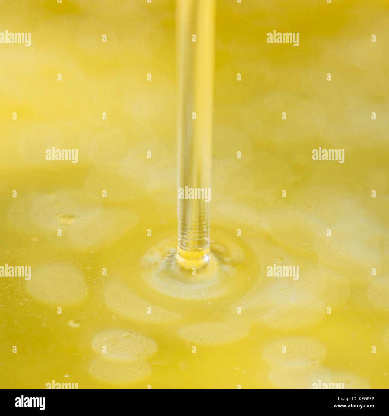 The shock waves from a stream of water entering a small pool Stock ...