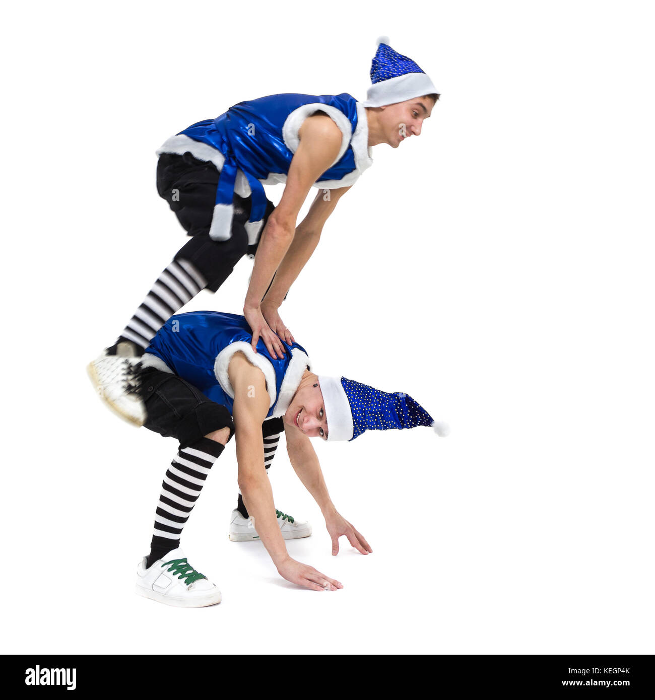 two Christmas men in blue santa clothes dancing against isolated white ...
