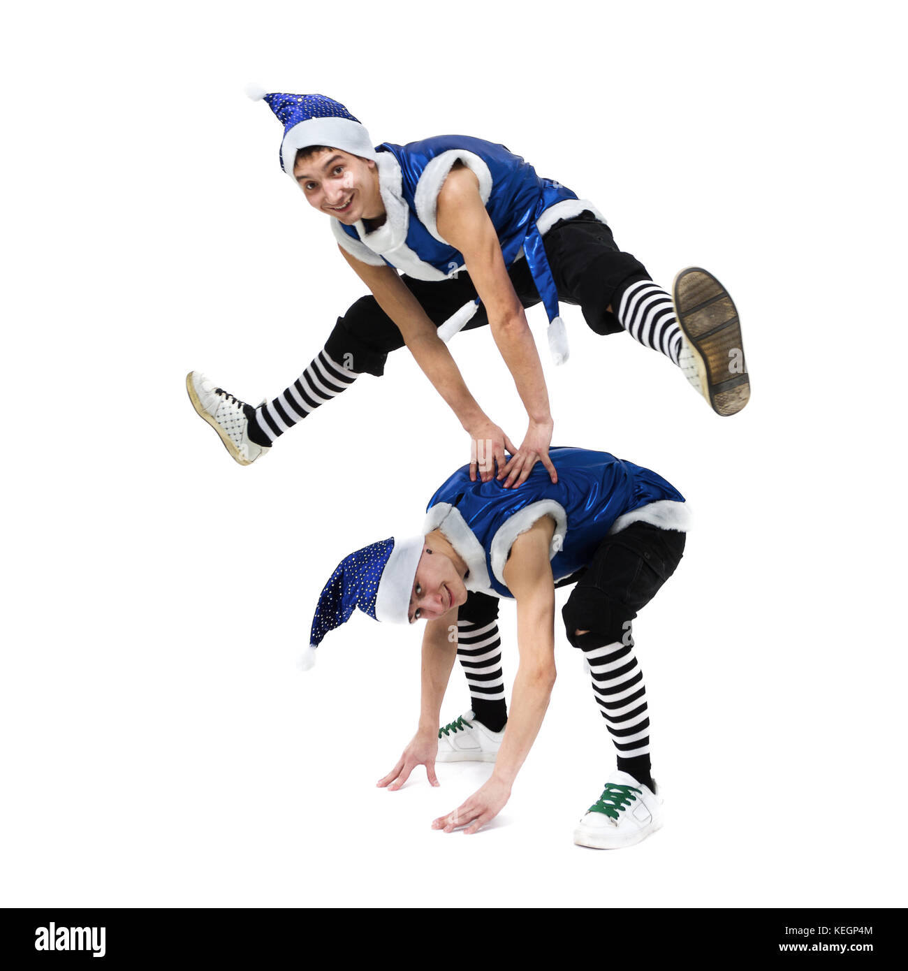 two Christmas men in blue santa clothes dancing against isolated white ...