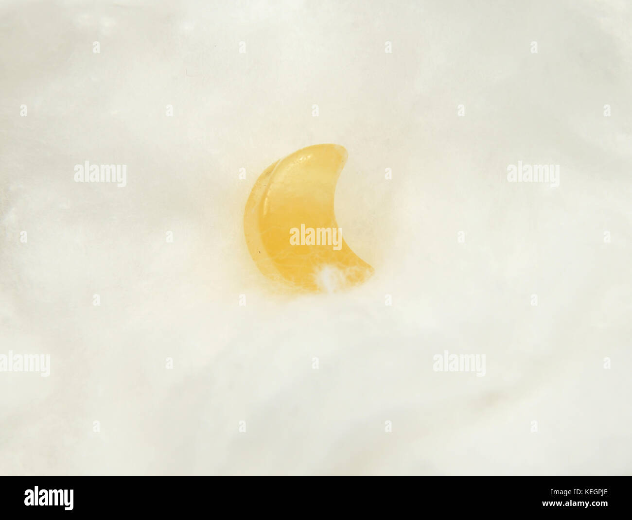 Orange calcite mineral on cotton Stock Photo - Alamy