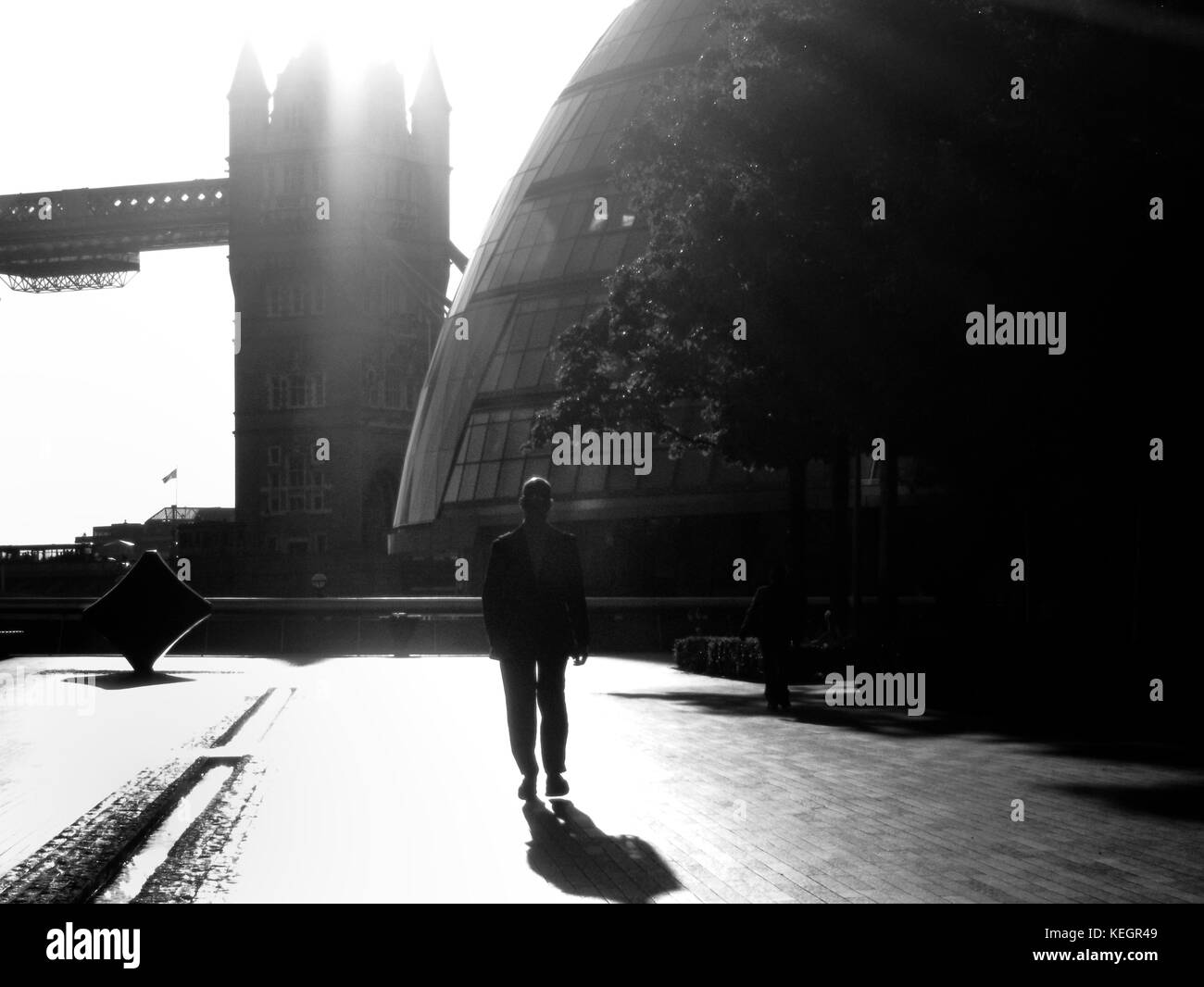 Man walking on the street at More London district Stock Photo - Alamy