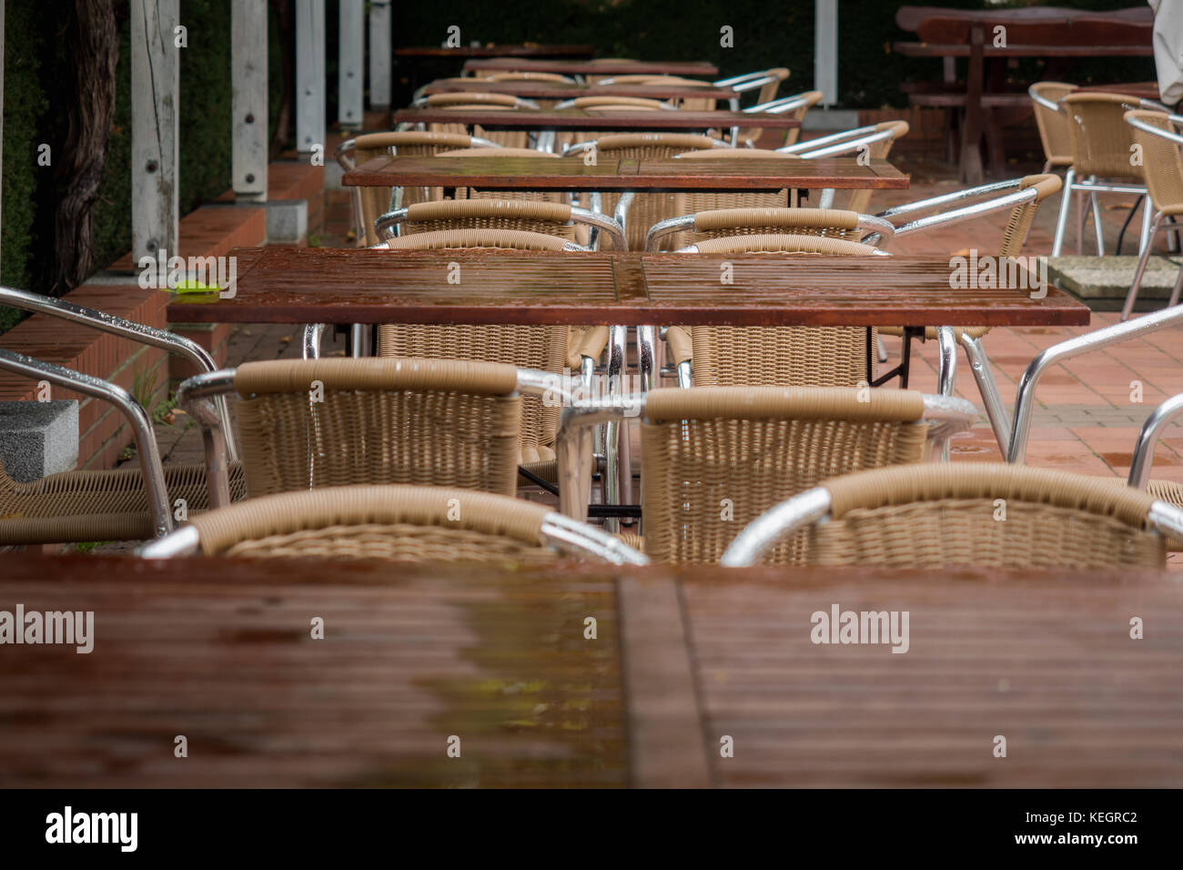 Tables and chairs on a terrace from the restaurant Stock Photo - Alamy