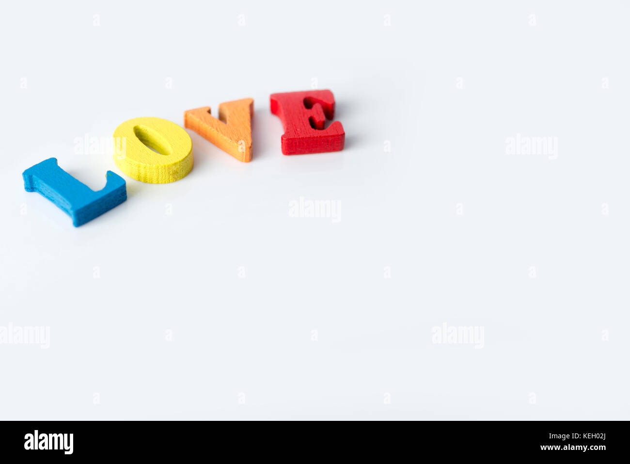 The word love on the white background of colorful letters Stock Photo ...