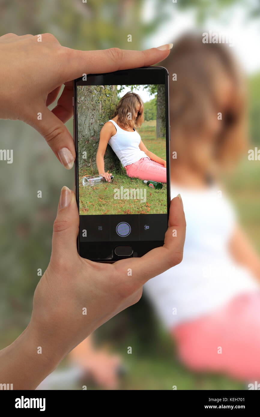Cybermobbing an bullying and taking picture of drunken girl Stock Photo ...