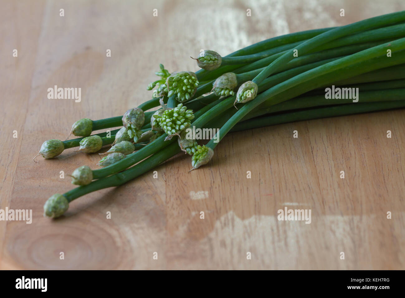 Chives flower or Chinese Chive vegetable on wooden Stock Photo - Alamy