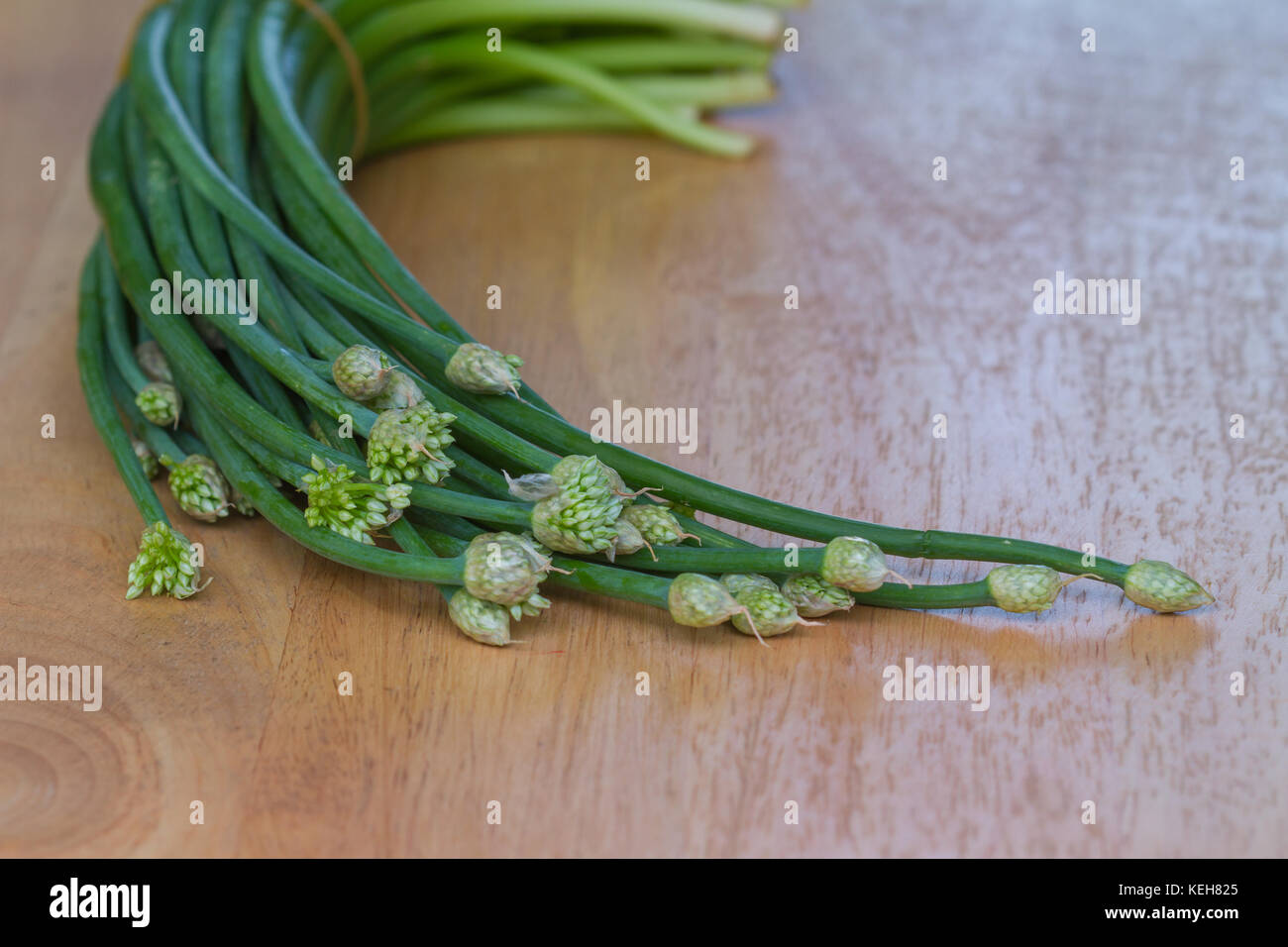 Chives flower or Chinese Chive vegetable on wooden Stock Photo - Alamy