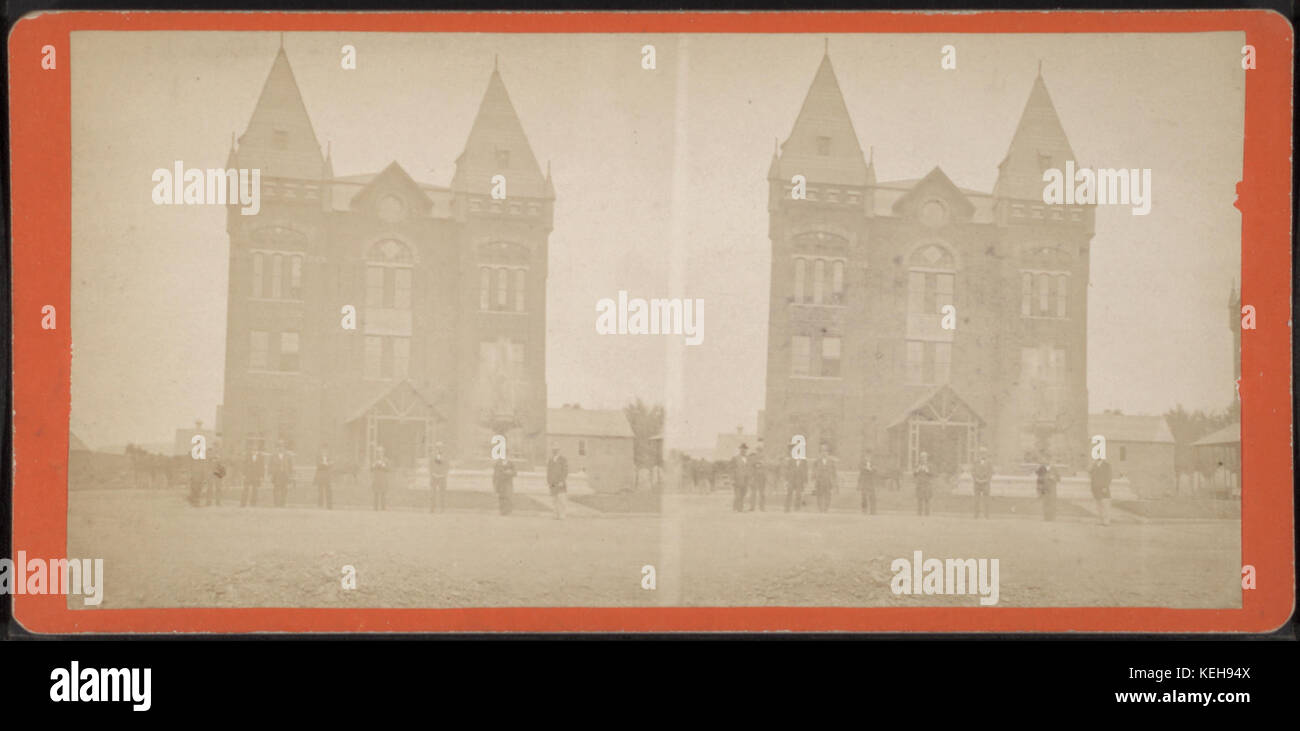 Group of men standing in line in front of building, by Ackerman Bros ...