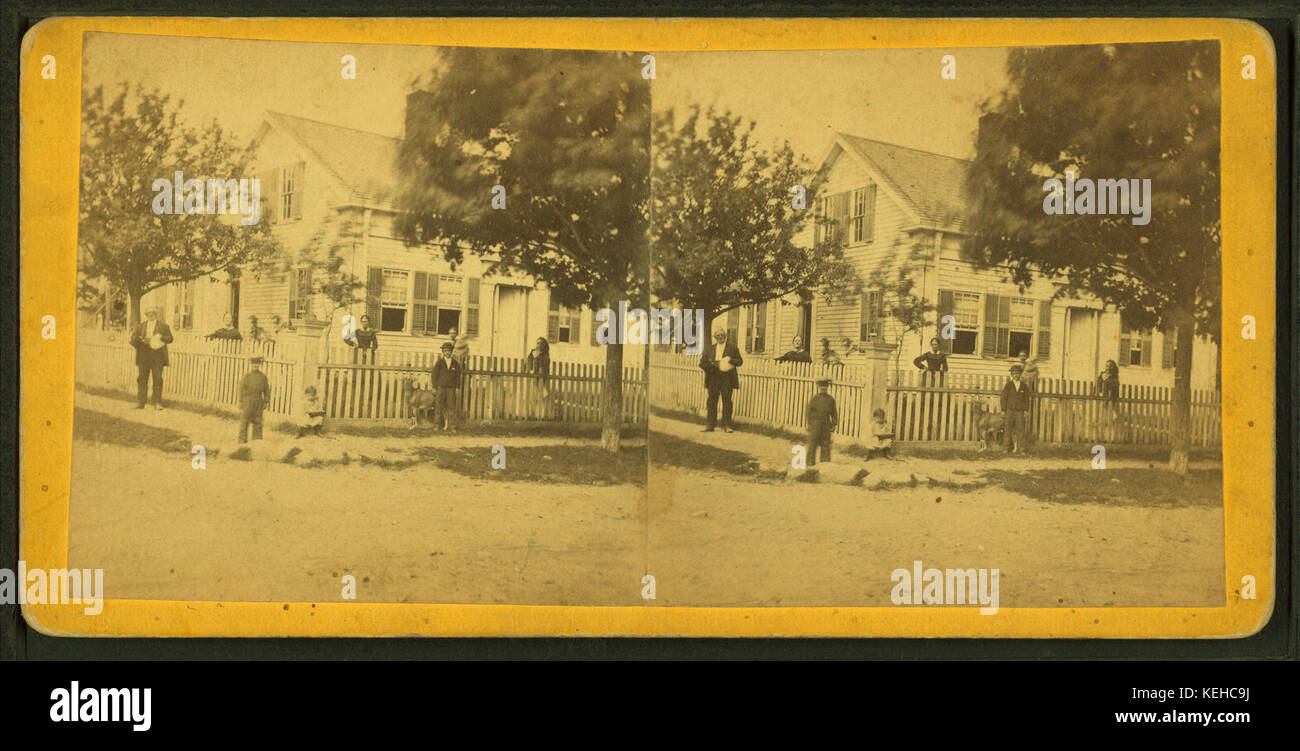 This stereoscopic view shows a family group, both adults and children ...