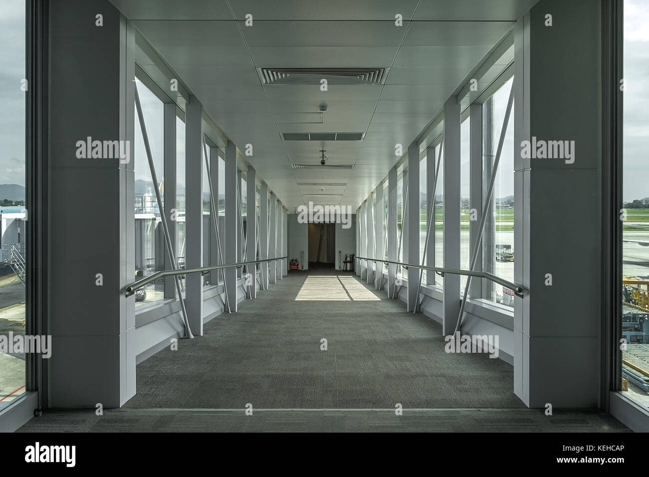 Walkway to airplane, Inside bridge that headed to plane Stock Photo - Alamy