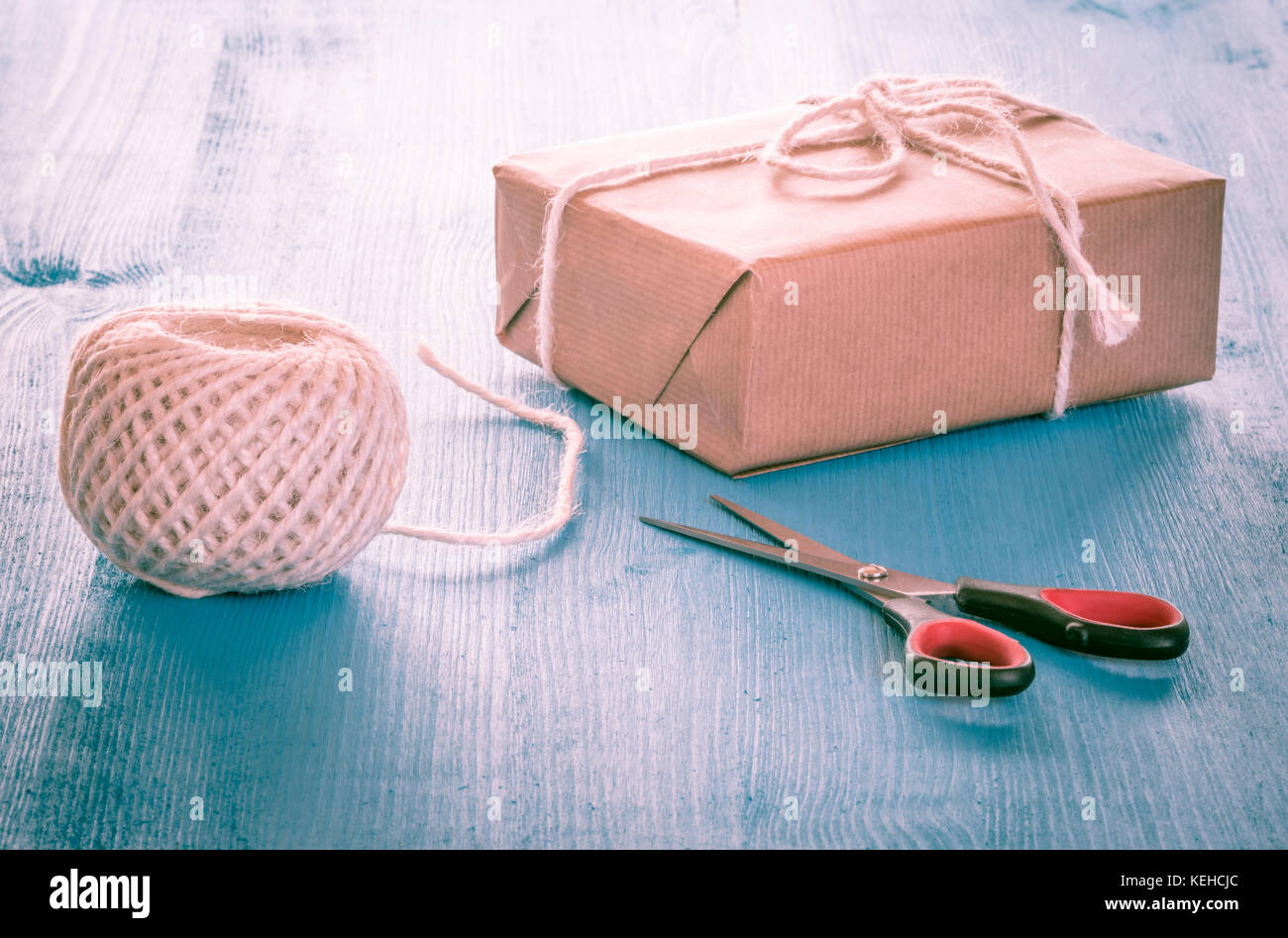 Gift box homemade, wrapped in classic brown paper, ball of string and ...