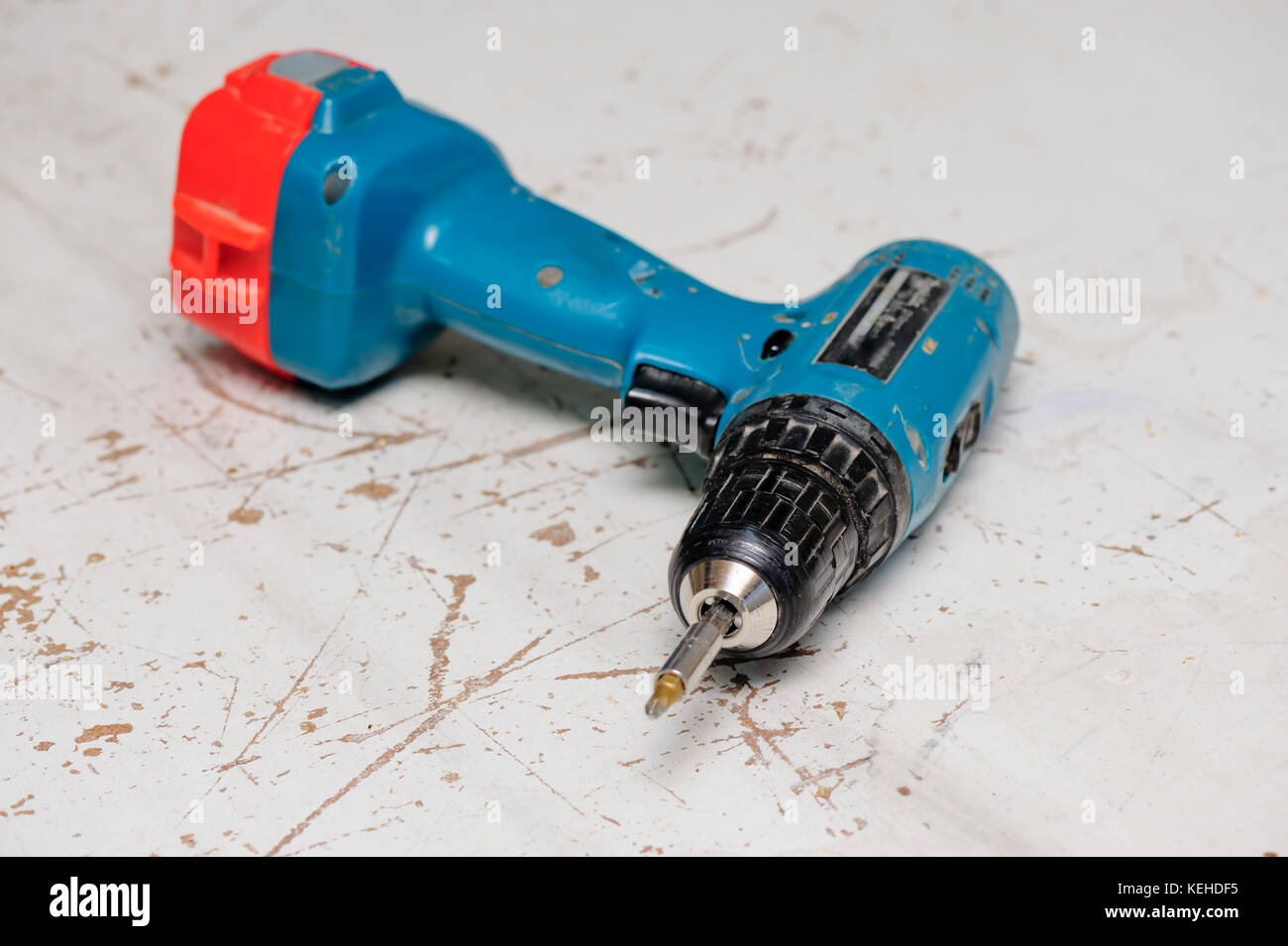 old used cordless electric screwdriver at working surface Stock Photo ...