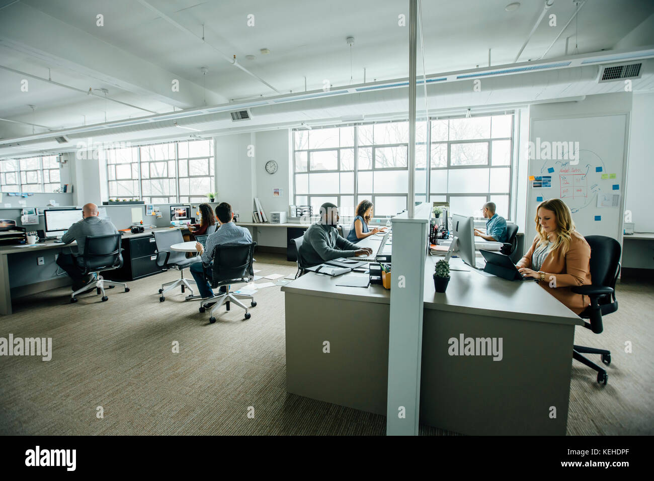 Business people working in busy office Stock Photo - Alamy