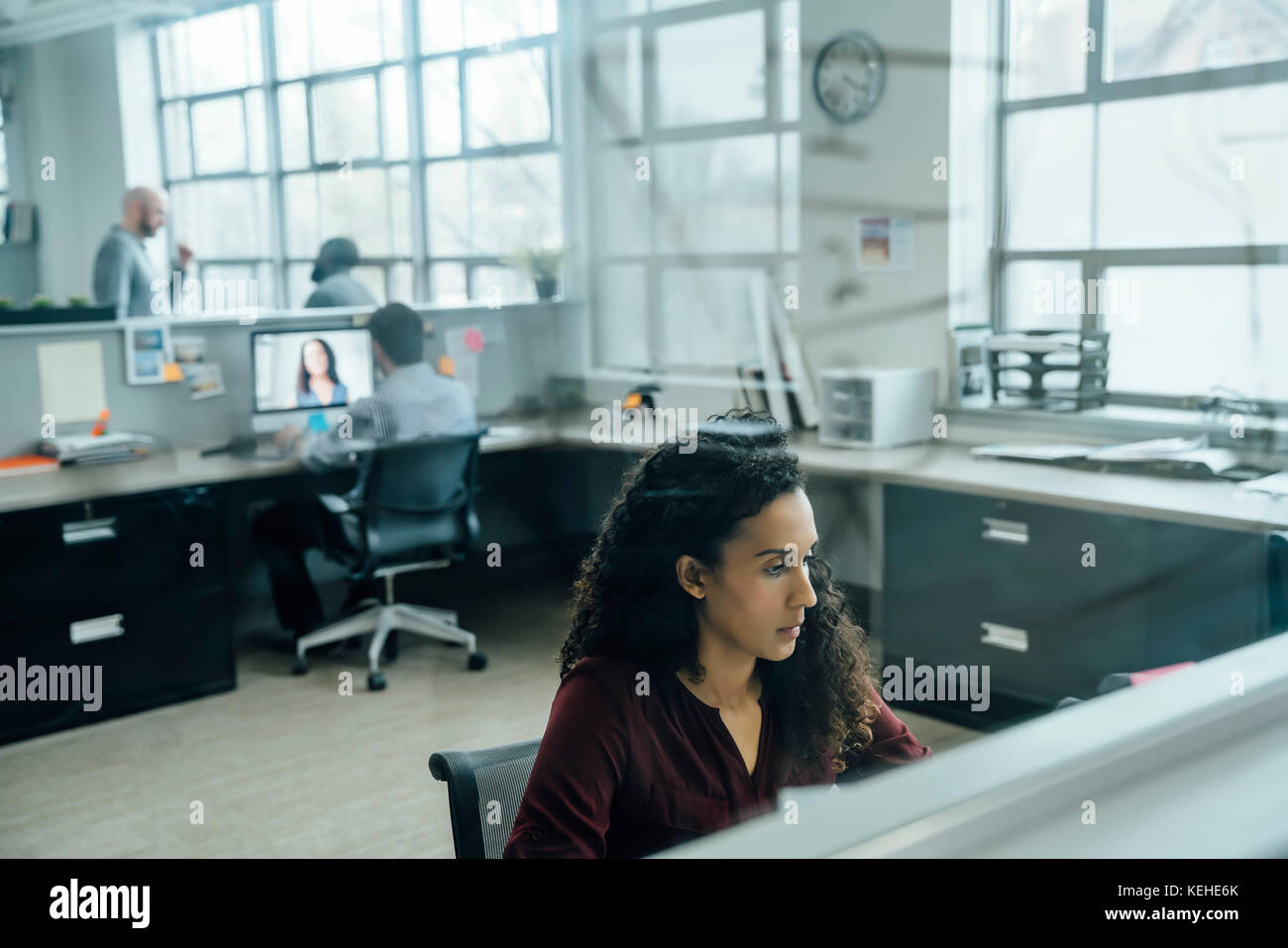 Business people working in office behind window Stock Photo - Alamy