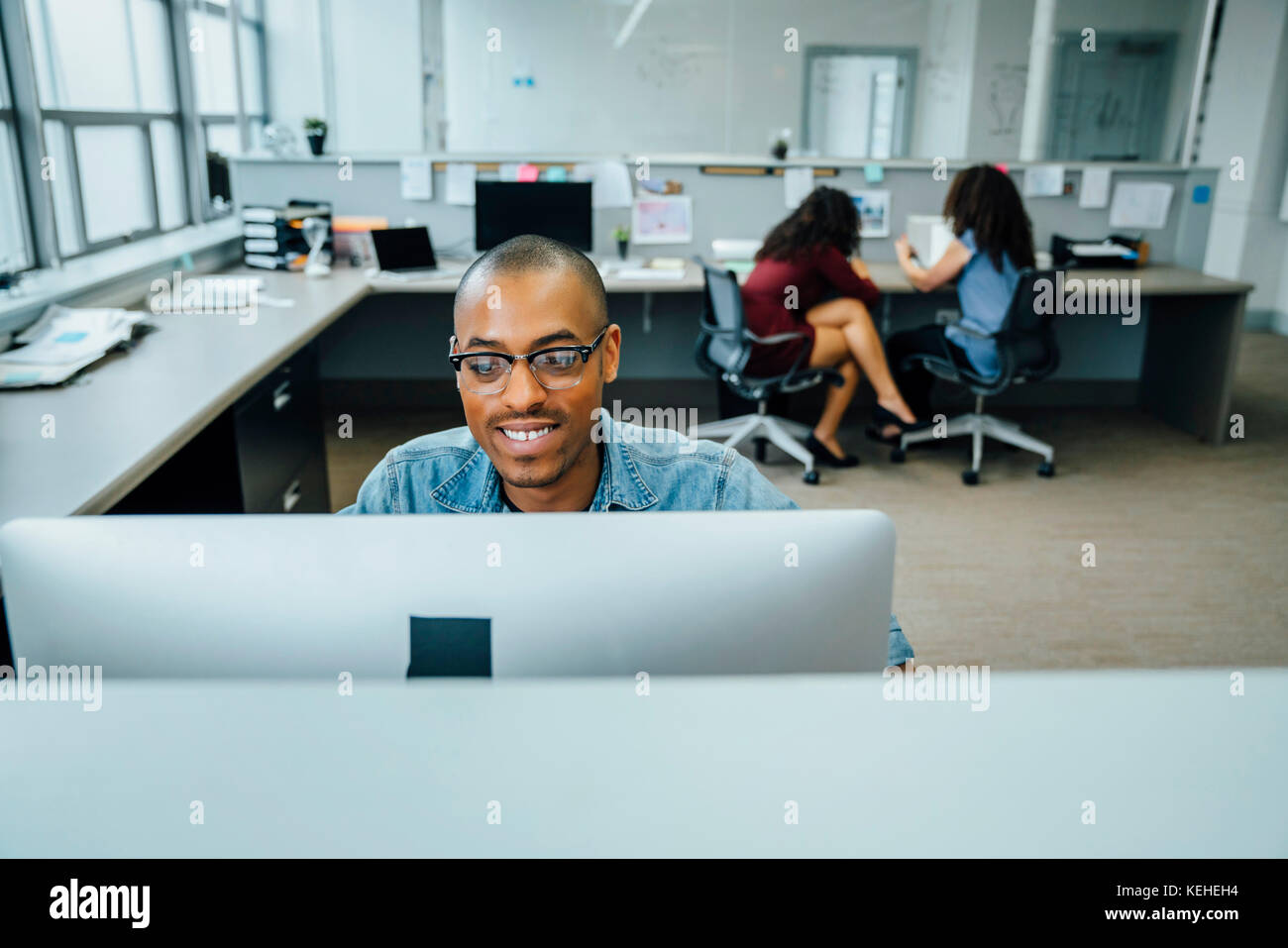 Businessman using computer in office Stock Photo - Alamy