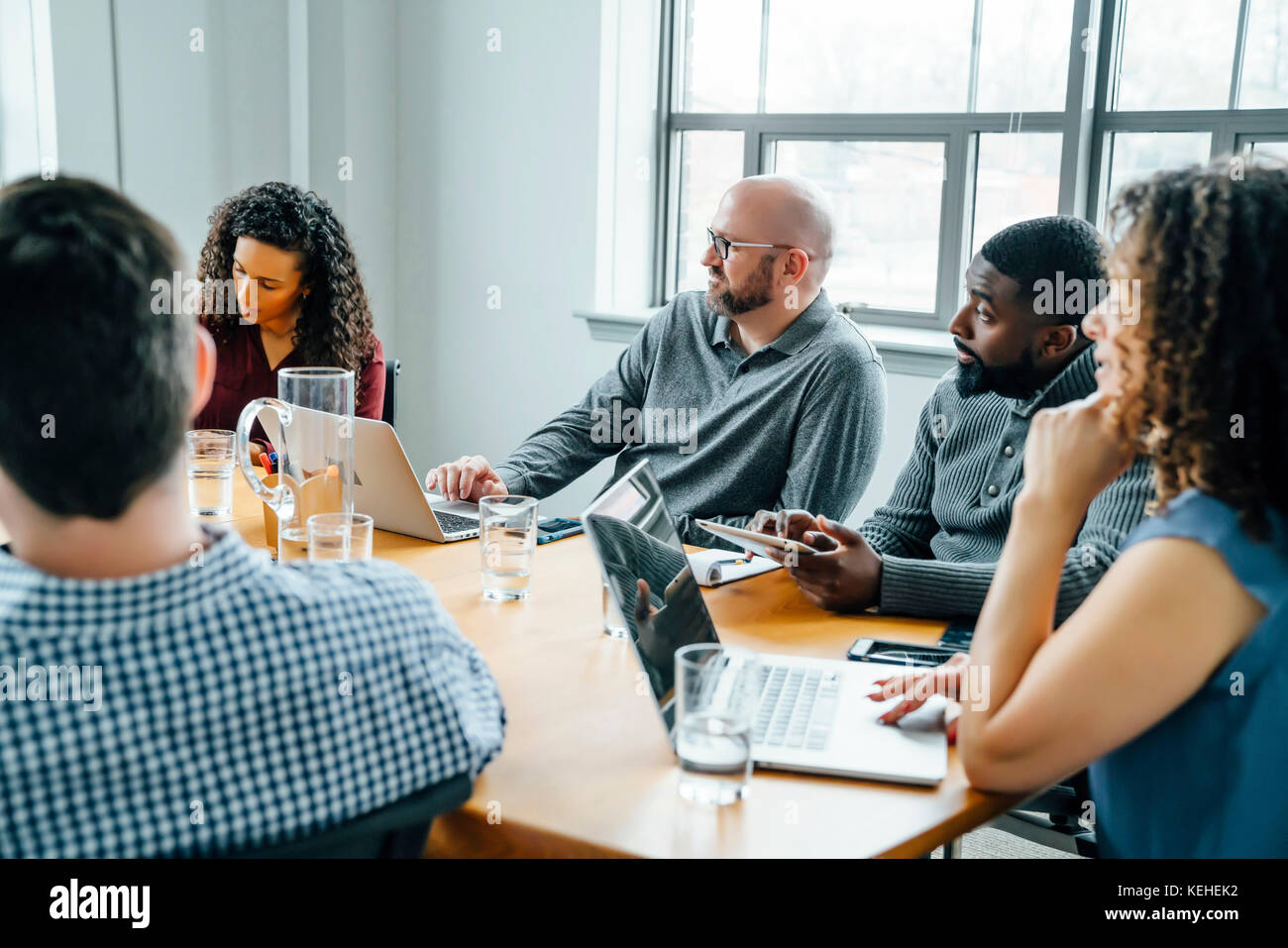 Business people listening in meeting Stock Photo - Alamy