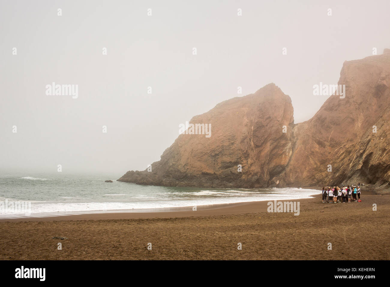 Distant crowd of people standing on beach Stock Photo - Alamy