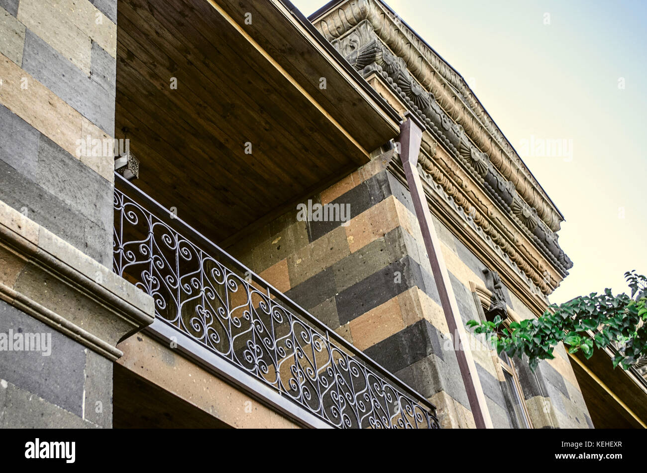 Loggia and carved cornice on the facade of the old building Stock Photo ...