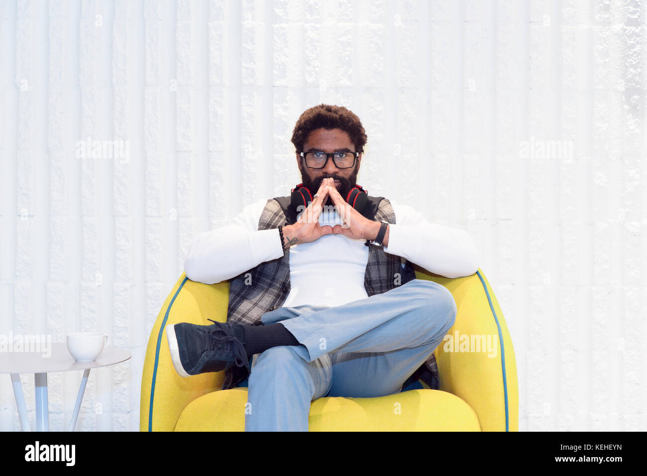 African american sitting chair hi-res stock photography and images - Alamy