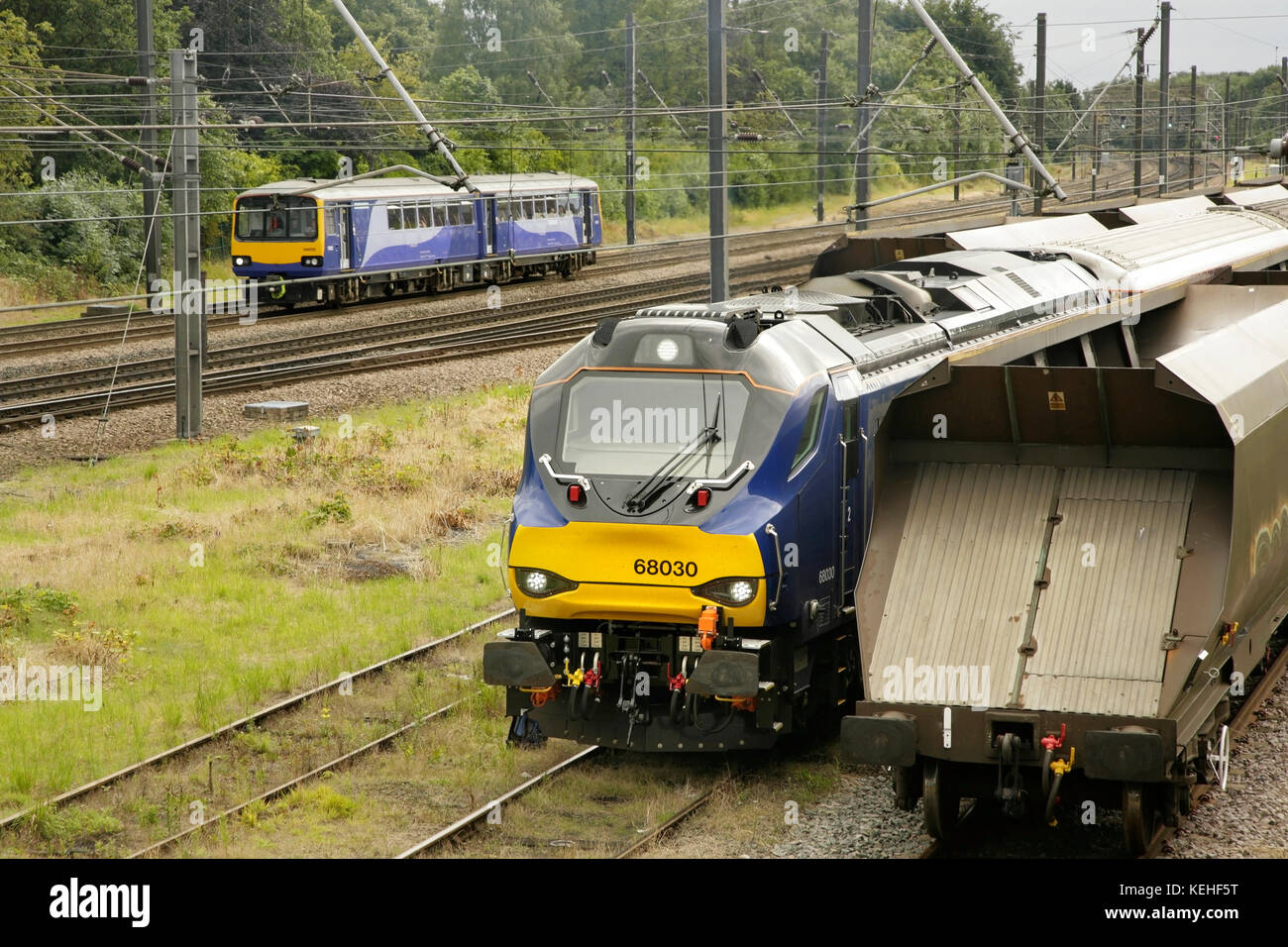 Northern Rail class 144 train passing Direct Rail Services class 68 ...
