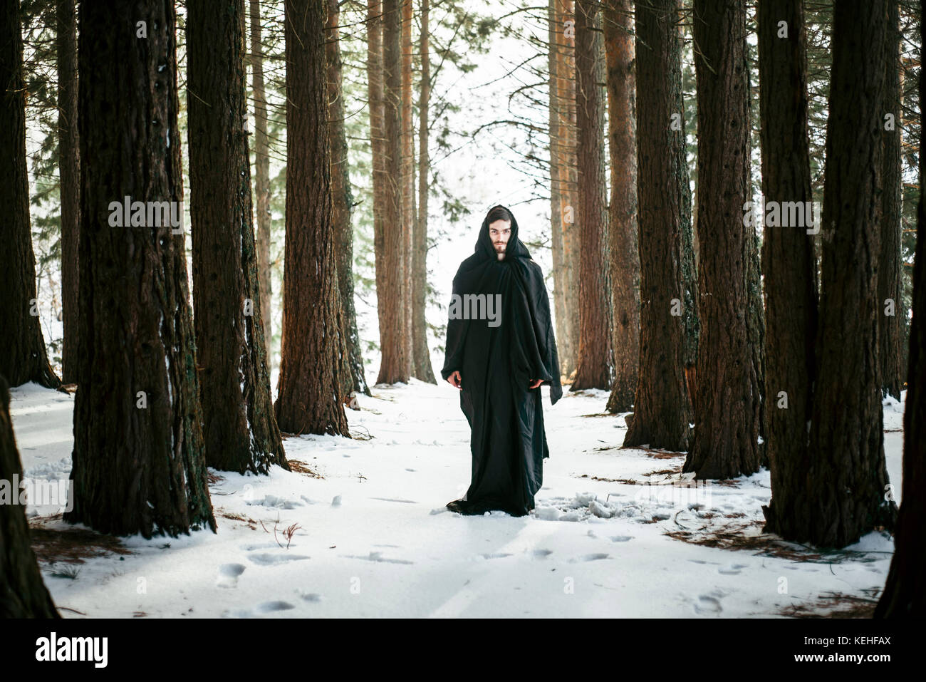 Man in black cloak with hood hi-res stock photography and images - Alamy
