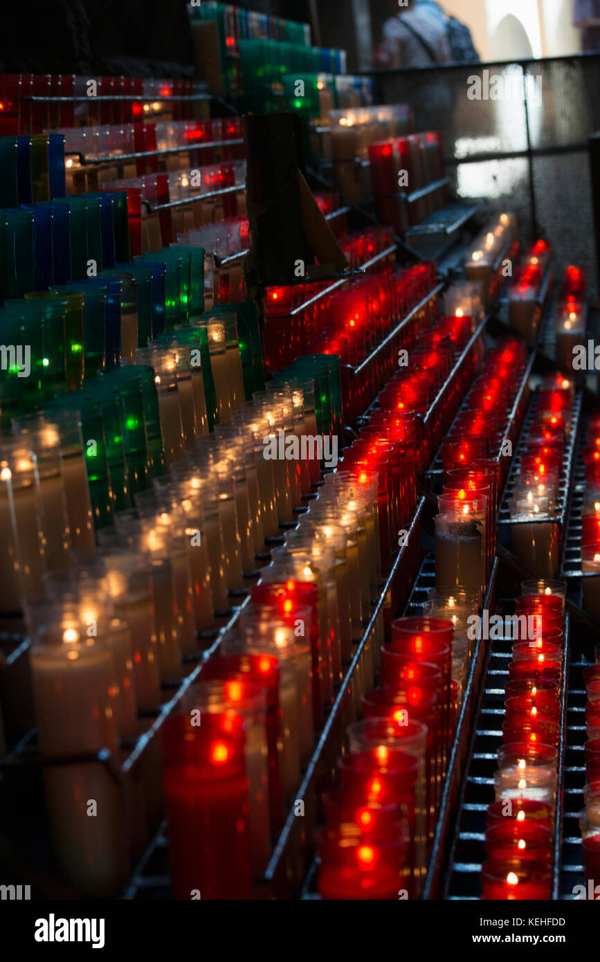 Lit candles in church Stock Photo - Alamy