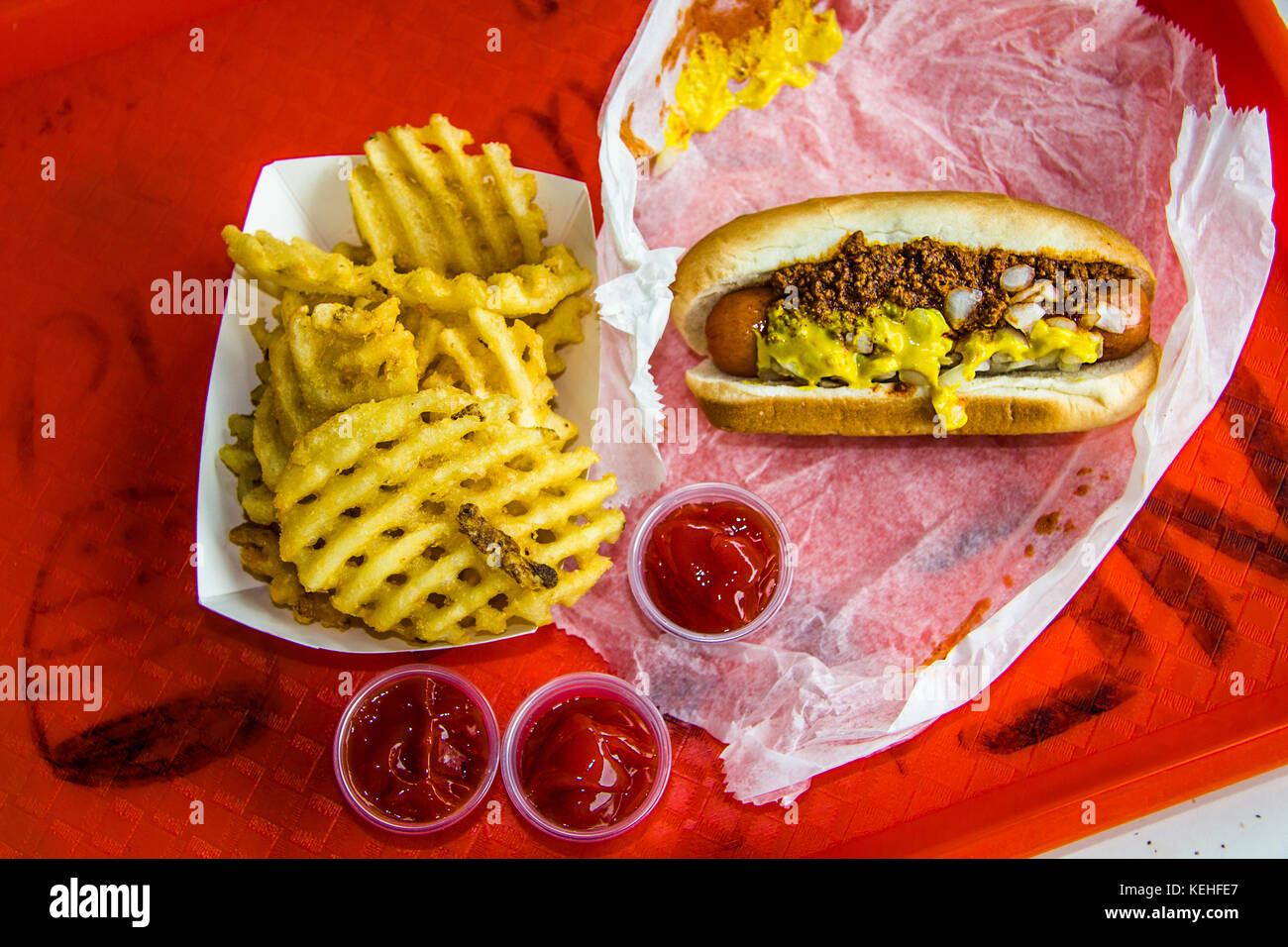 Hot dog and french fries on tray Stock Photo - Alamy