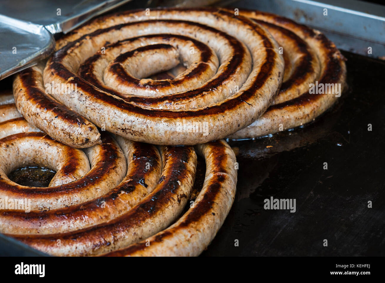 Links of meat cooking on grille Stock Photo - Alamy