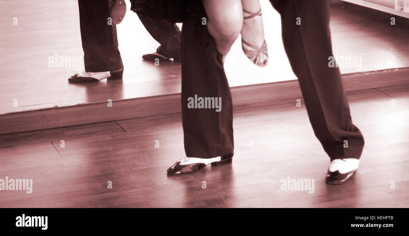 Ballroom dance couple of dancers and teachers in studio school dancing ...