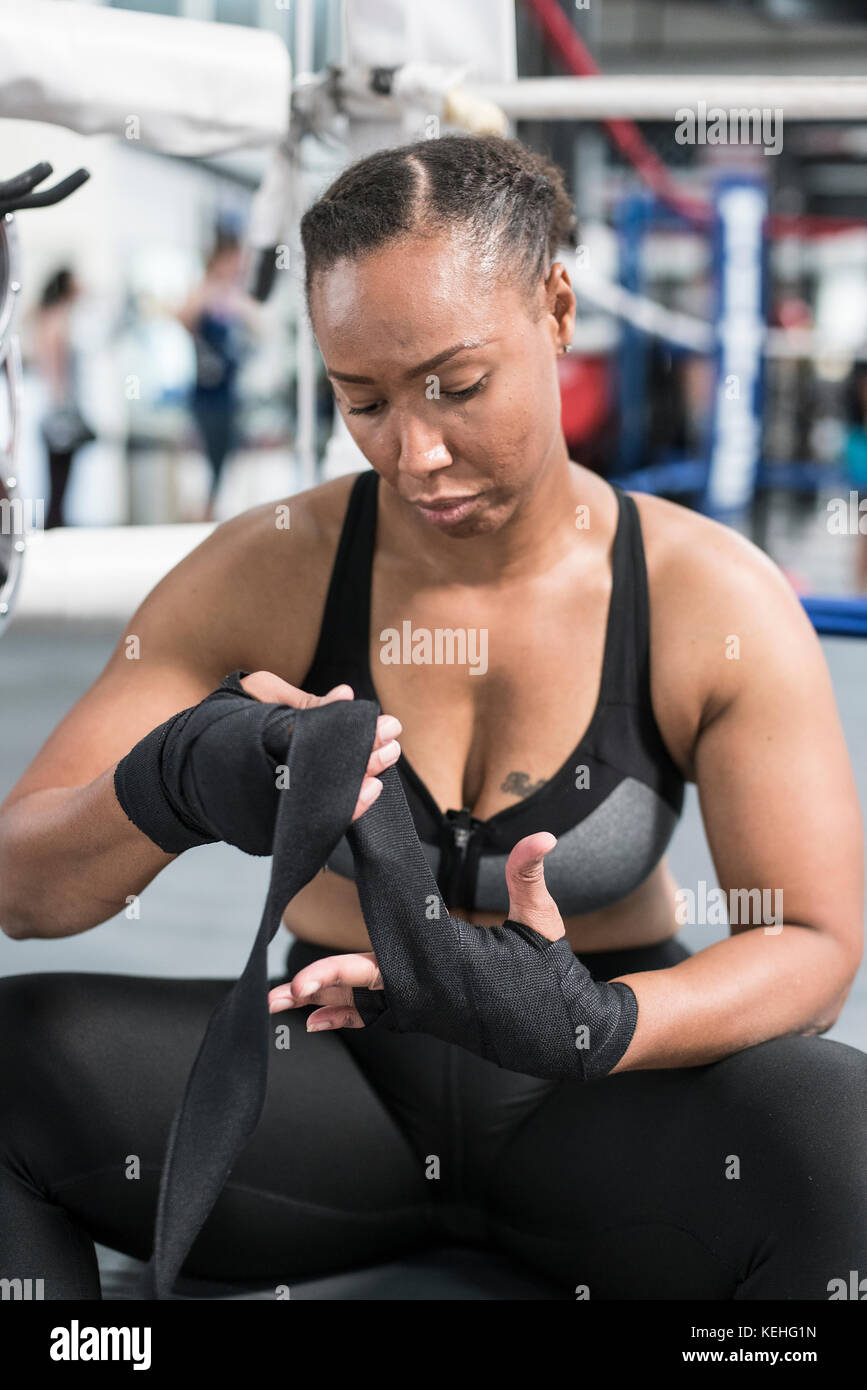 Female boxer wrapping hands hi-res stock photography and images - Alamy