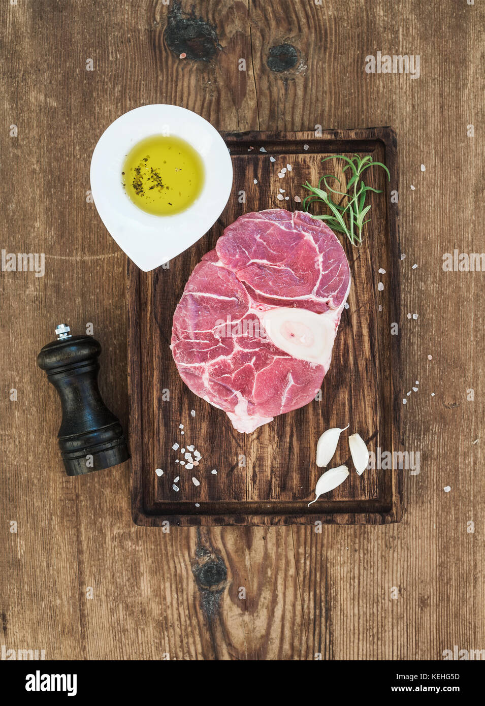 Raw fresh beef meat cross cut for ossobuco cut with garlic cloves ...
