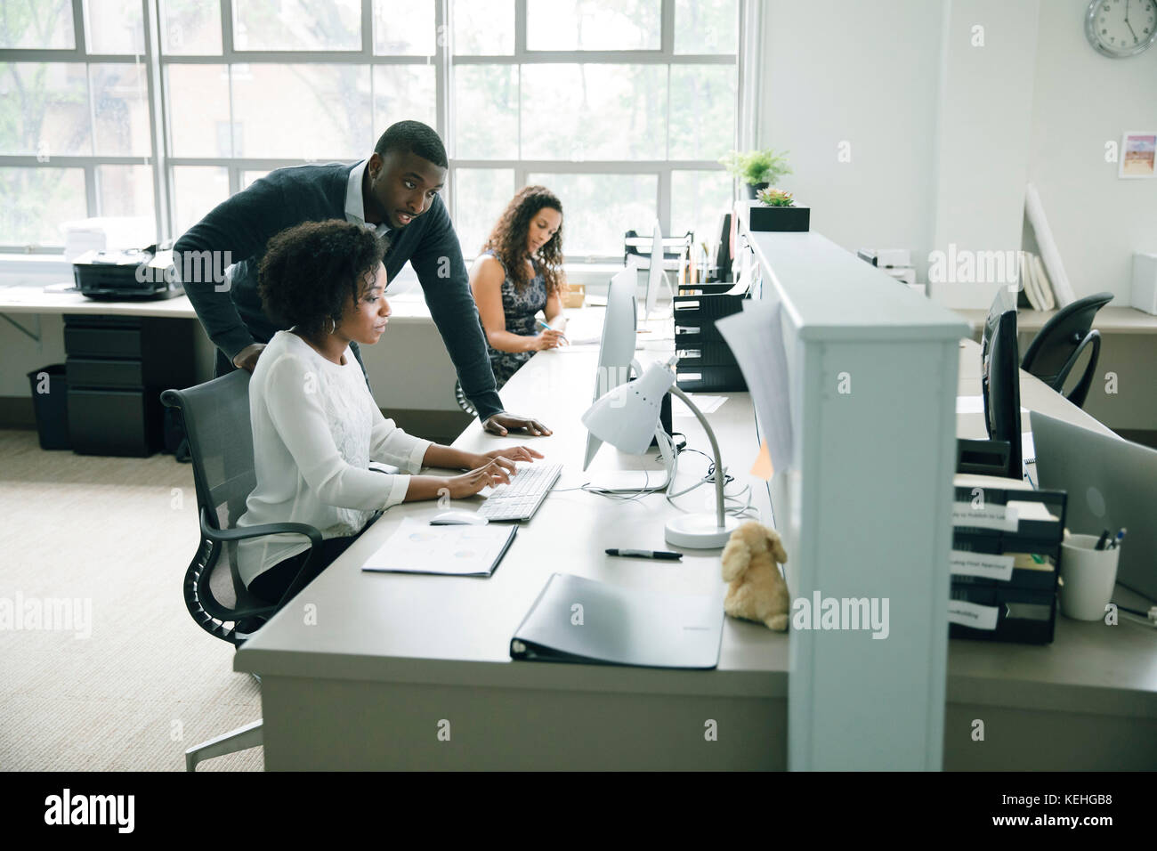 Business people using computer in office Stock Photo - Alamy
