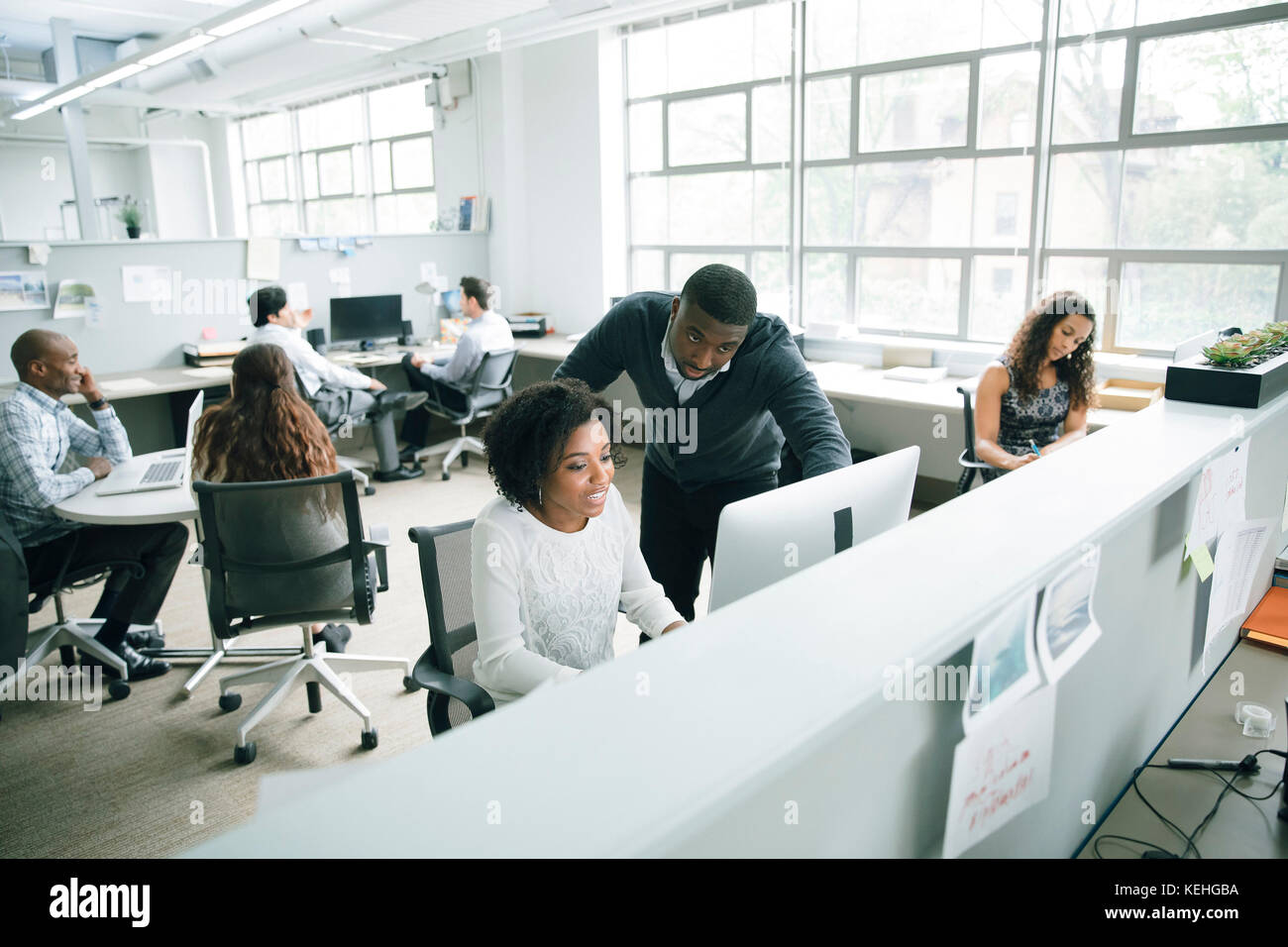 Business people using computer in office Stock Photo - Alamy