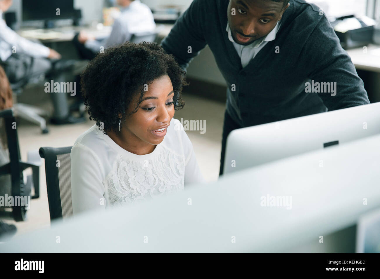 Business people using computer in office Stock Photo - Alamy