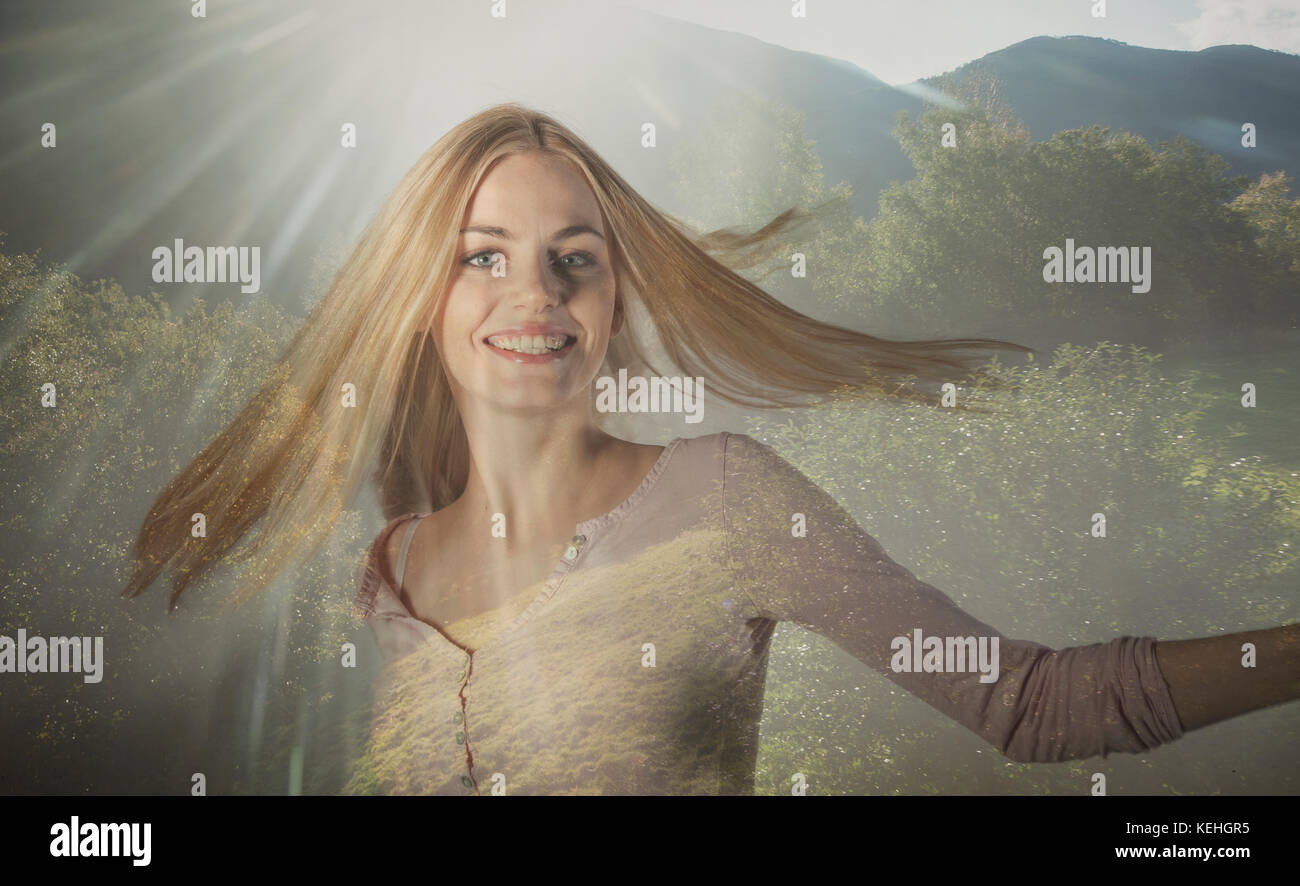 Double exposure of Caucasian woman spinning in forest trees Stock Photo ...