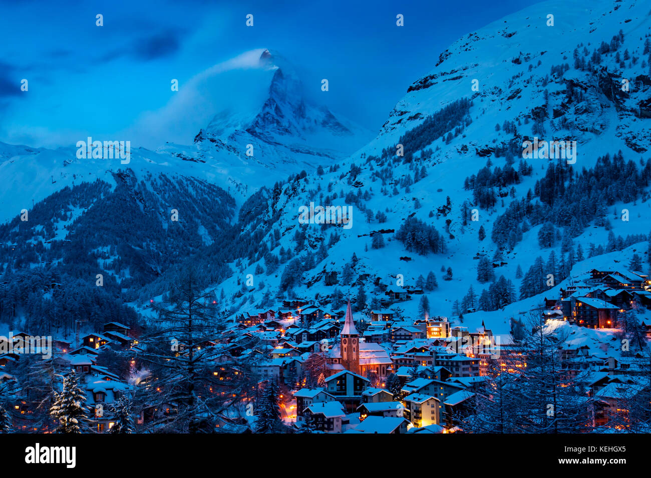 Evening over Swiss mountain town of Zermatt with peak of the Matterhorn ...