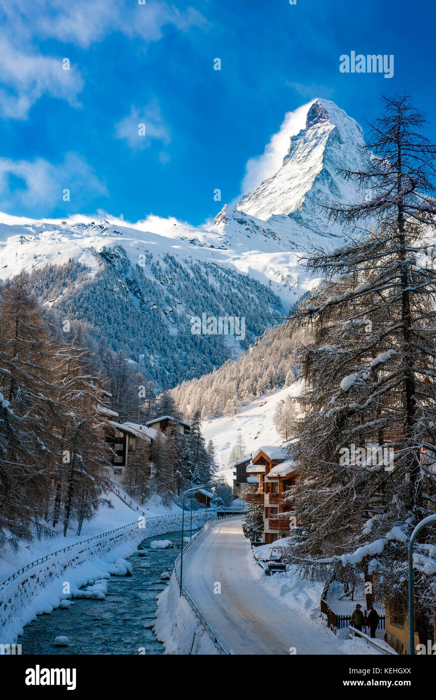 The Vispa River flows below the peak of the Matterhorn through town of ...