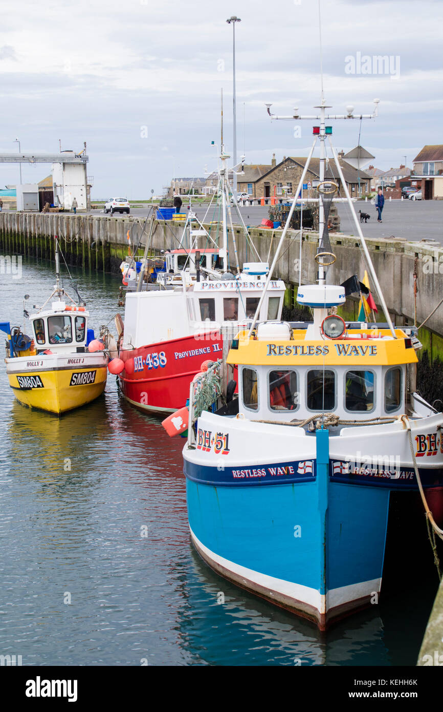 Colourful fishing boats on the River Coquet at Amble, Northumberland ...